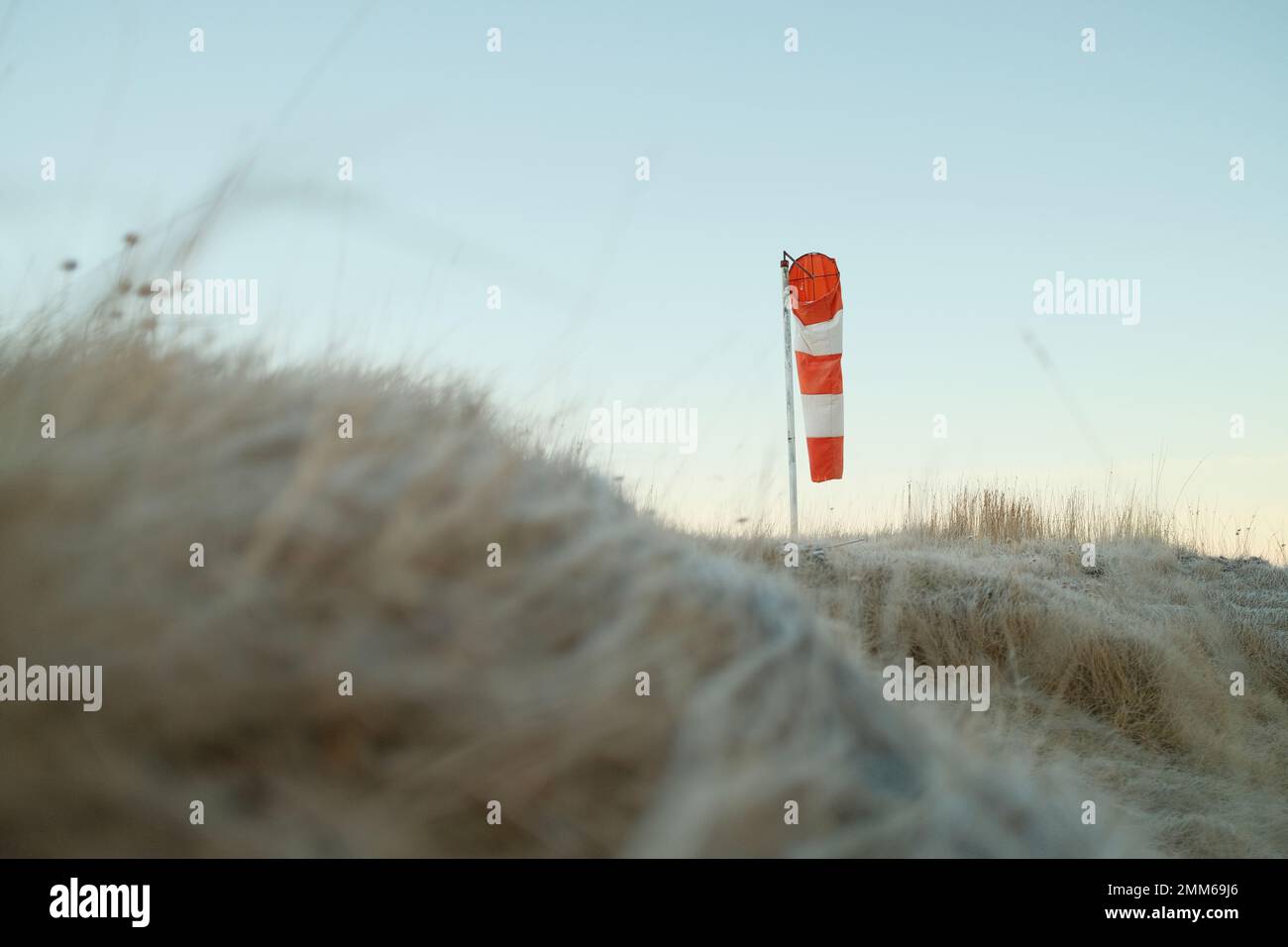 Cone windsock in windless weather Stock Photo - Alamy