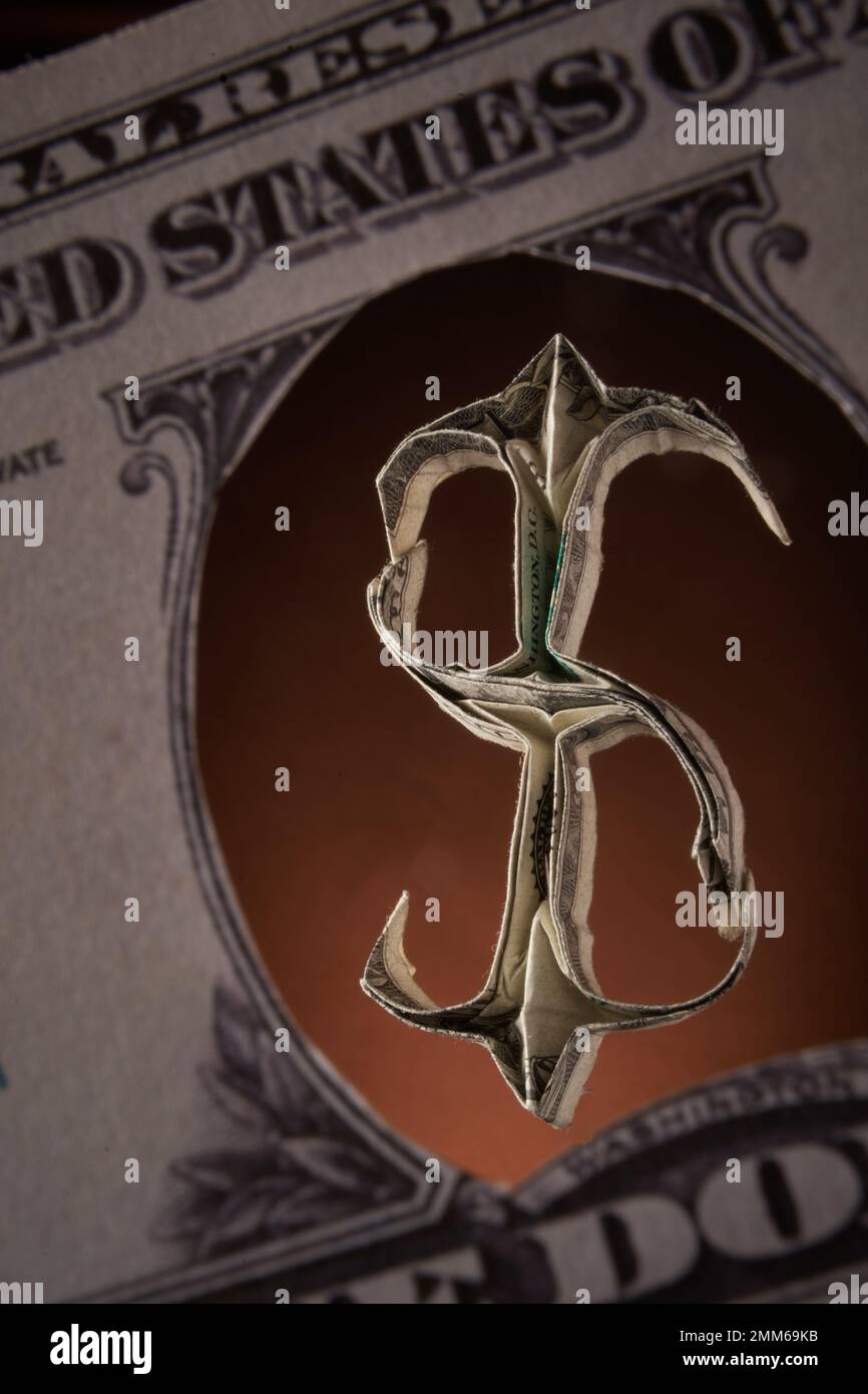Origami dollar symbol made from dollar bills Stock Photo - Alamy