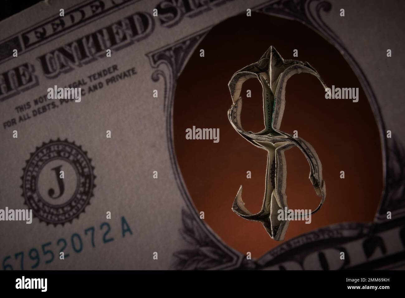 Origami dollar symbol made from dollar bills Stock Photo - Alamy