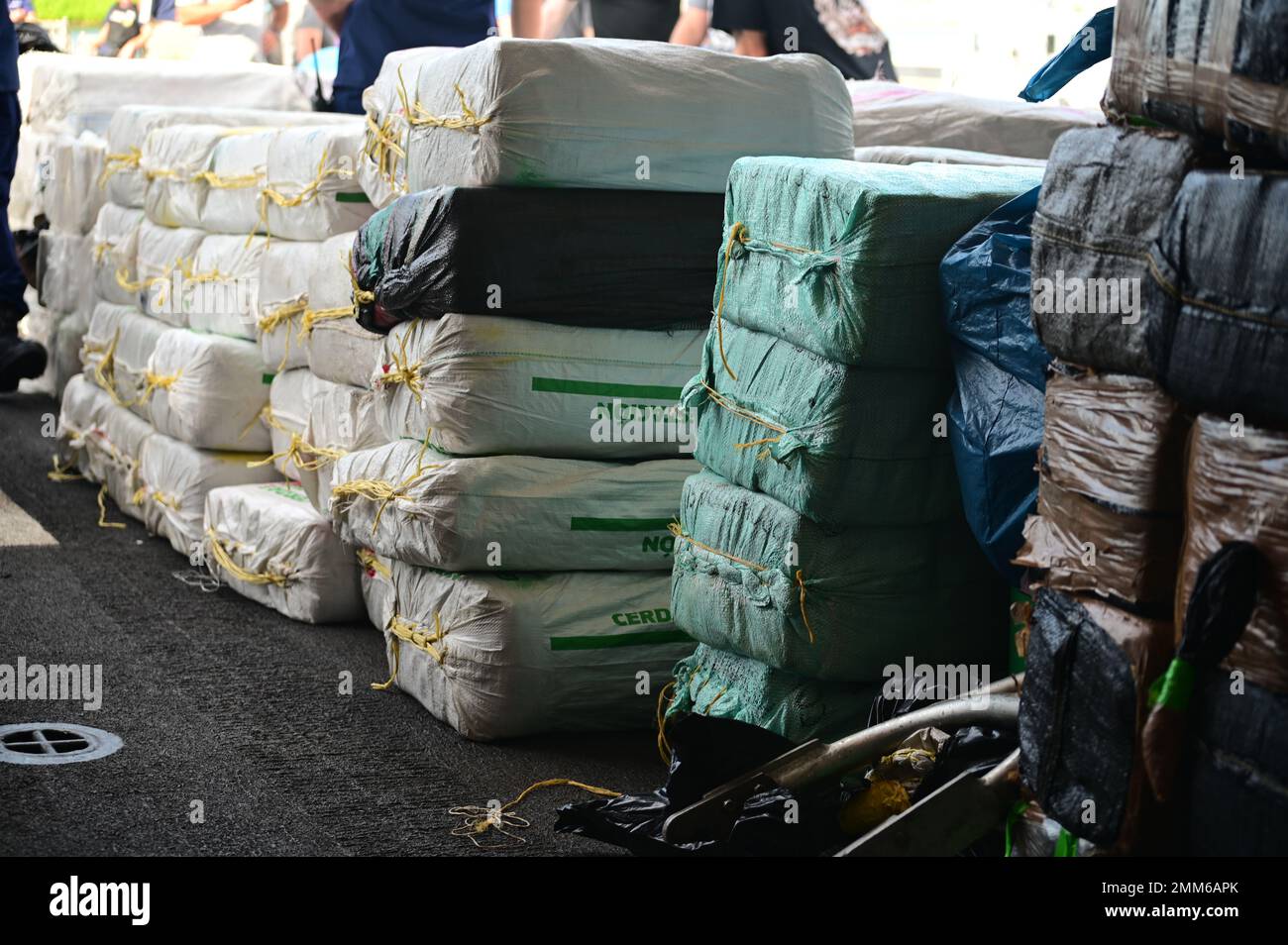 Bales of illegal drugs, worth an estimated $475 million, are offloaded ...