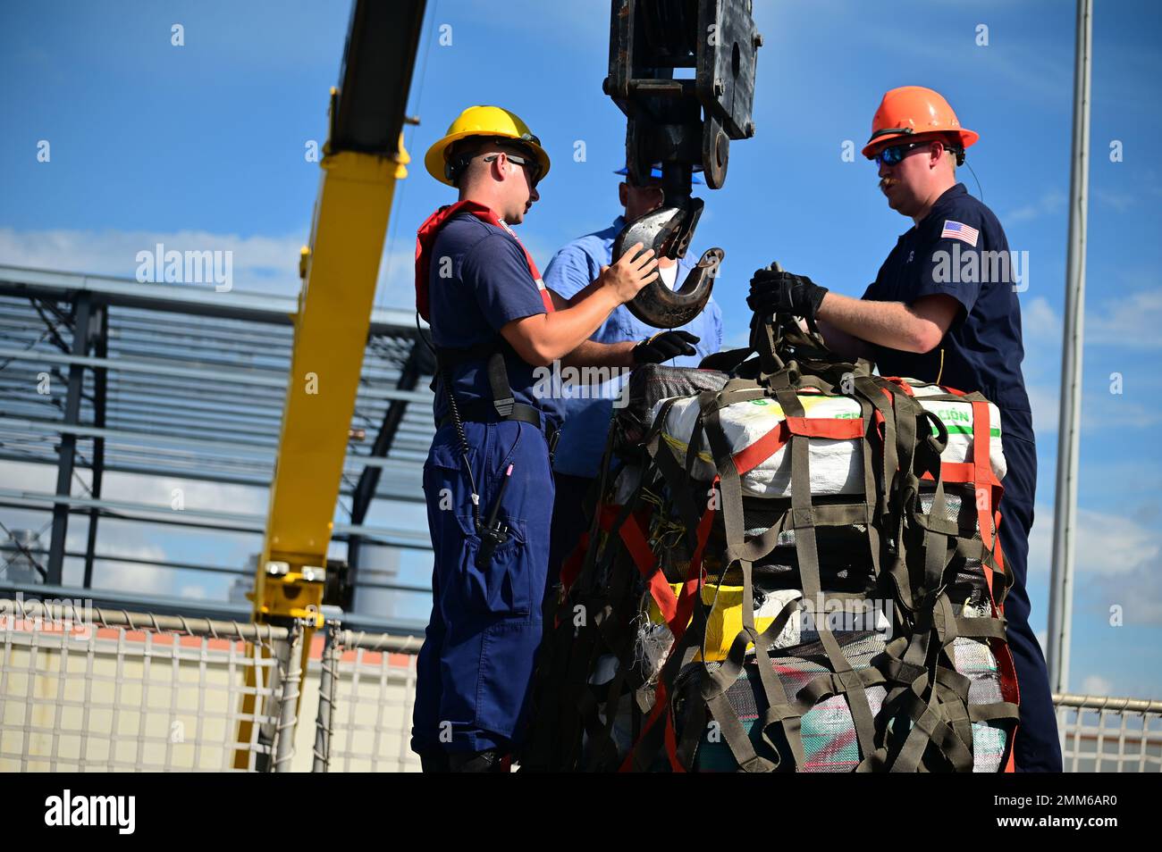 Bales of illegal drugs, worth an estimated $475 million, are offloaded ...