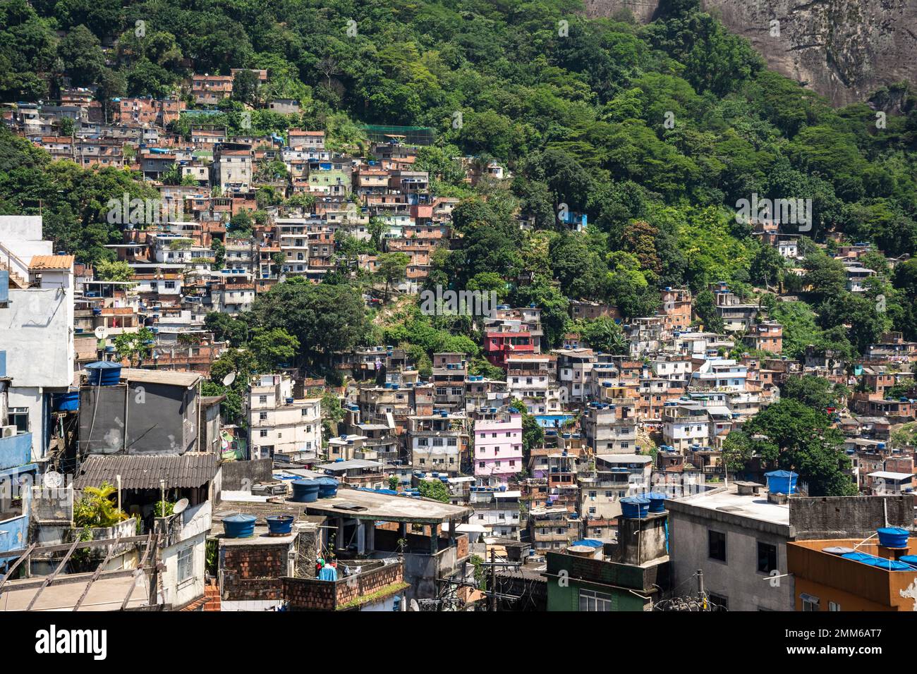 Beautiful view to poor favela houses on hill side Stock Photo - Alamy