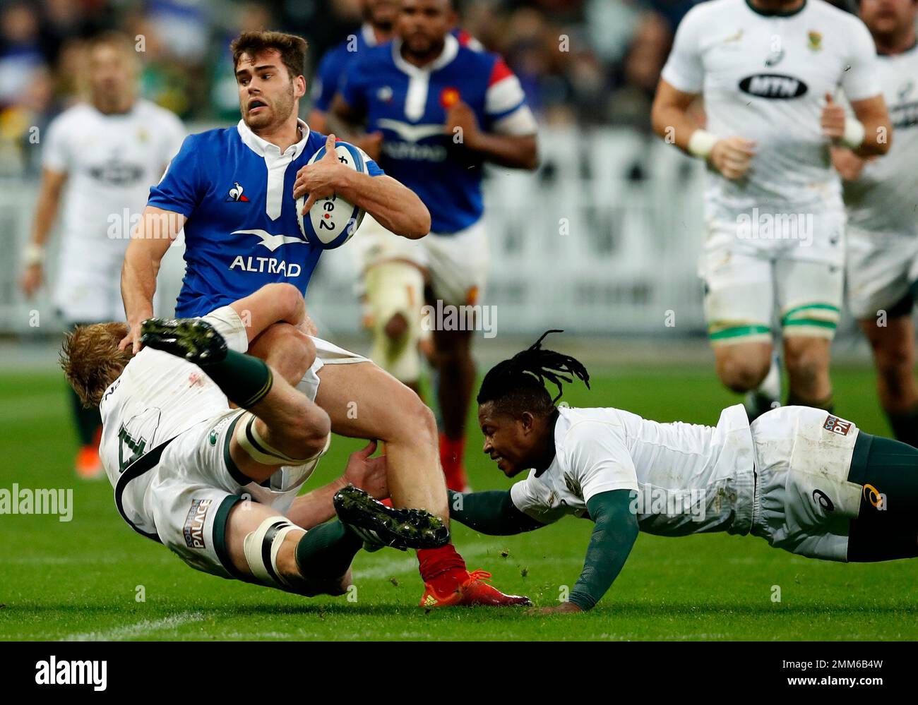 France's Damian Penaud is tackled by South Africa's Pieter-Steph du ...