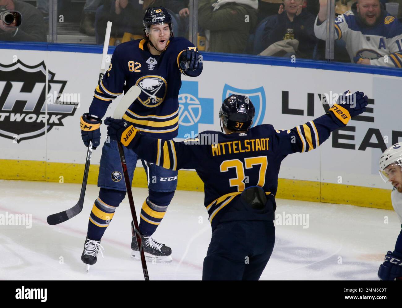 Buffalo Sabres defenseman Nathan Beaulieu (82) and forward Casey ...