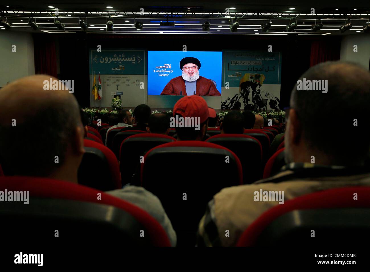Supporter of the Iranian-backed Hezbollah group listen to a speech of ...