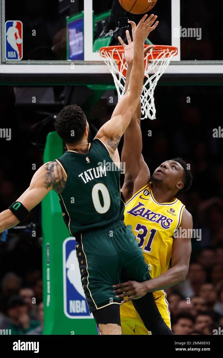 Boston Celtics' Jayson Tatum (0) shoots against Los Angeles Lakers' Thomas Bryant (31) during ...