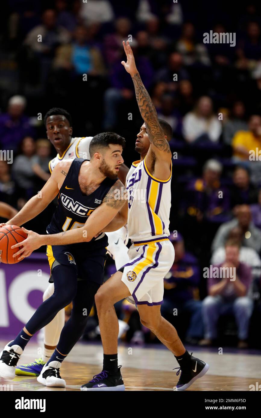 UNC Greensboro guard Francis Alonso (10) works the ball against LSU ...
