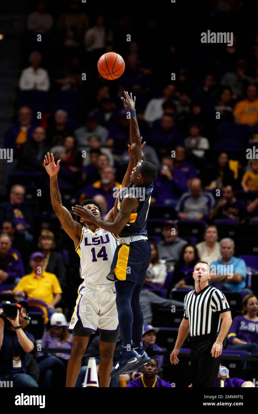 UNC Greensboro guard Isaiah Miller (1) shoots over LSU guard Marlon ...