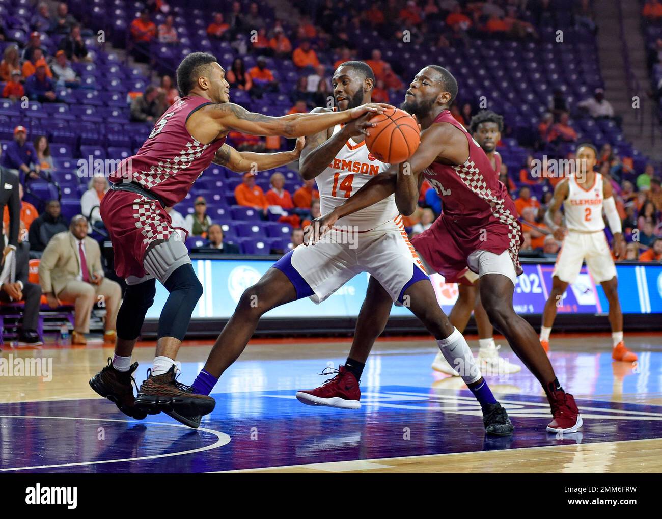 Clemson's Elijah Thomas, center, is pressured by North Carolina ...
