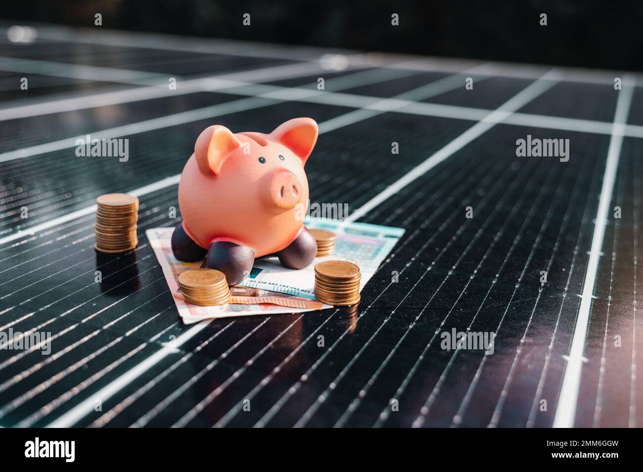 Money saved by using energy with solar panel on the roof Stock Photo ...