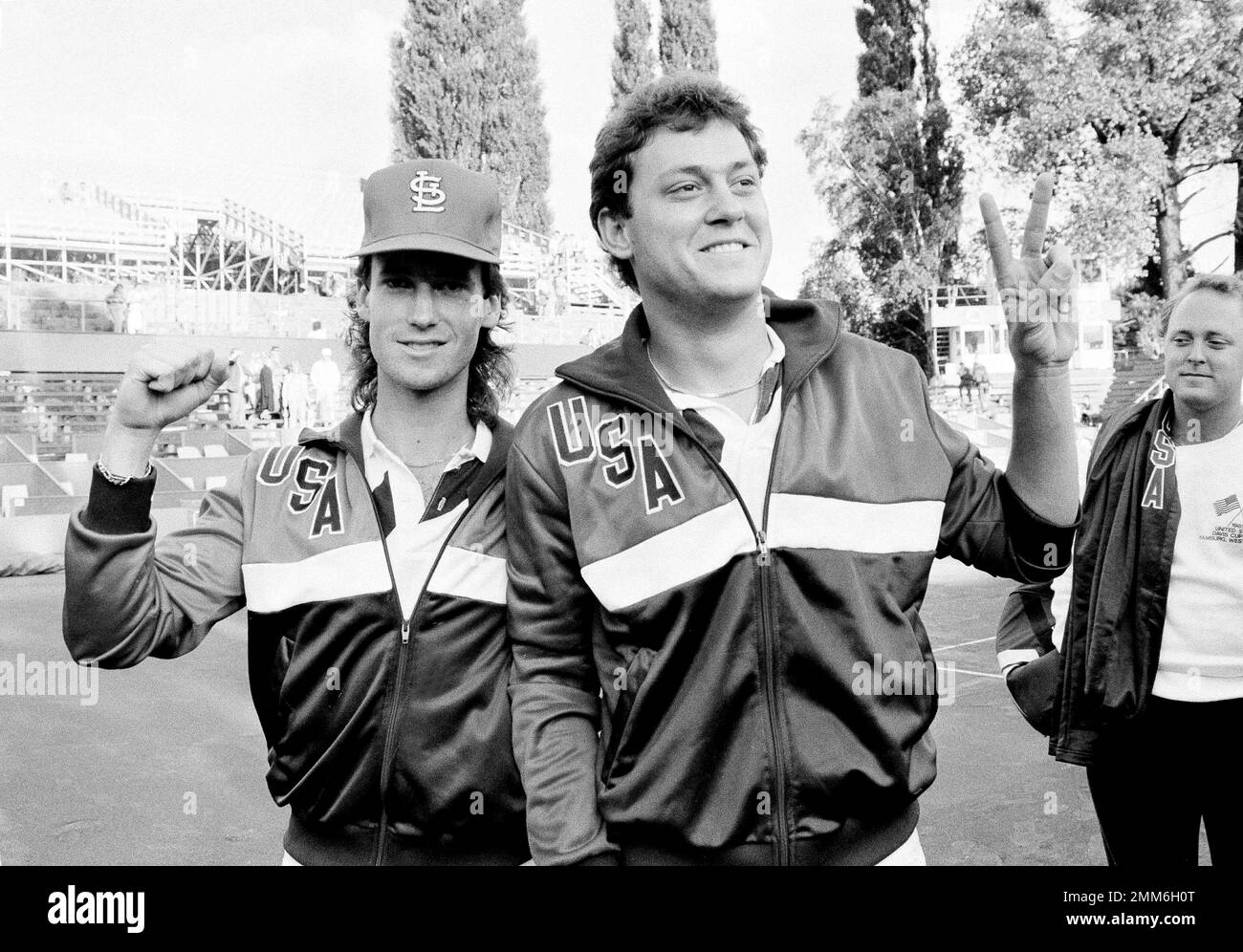 U.S. tennis player Ken Flach, left, raises his fist in triumph while ...