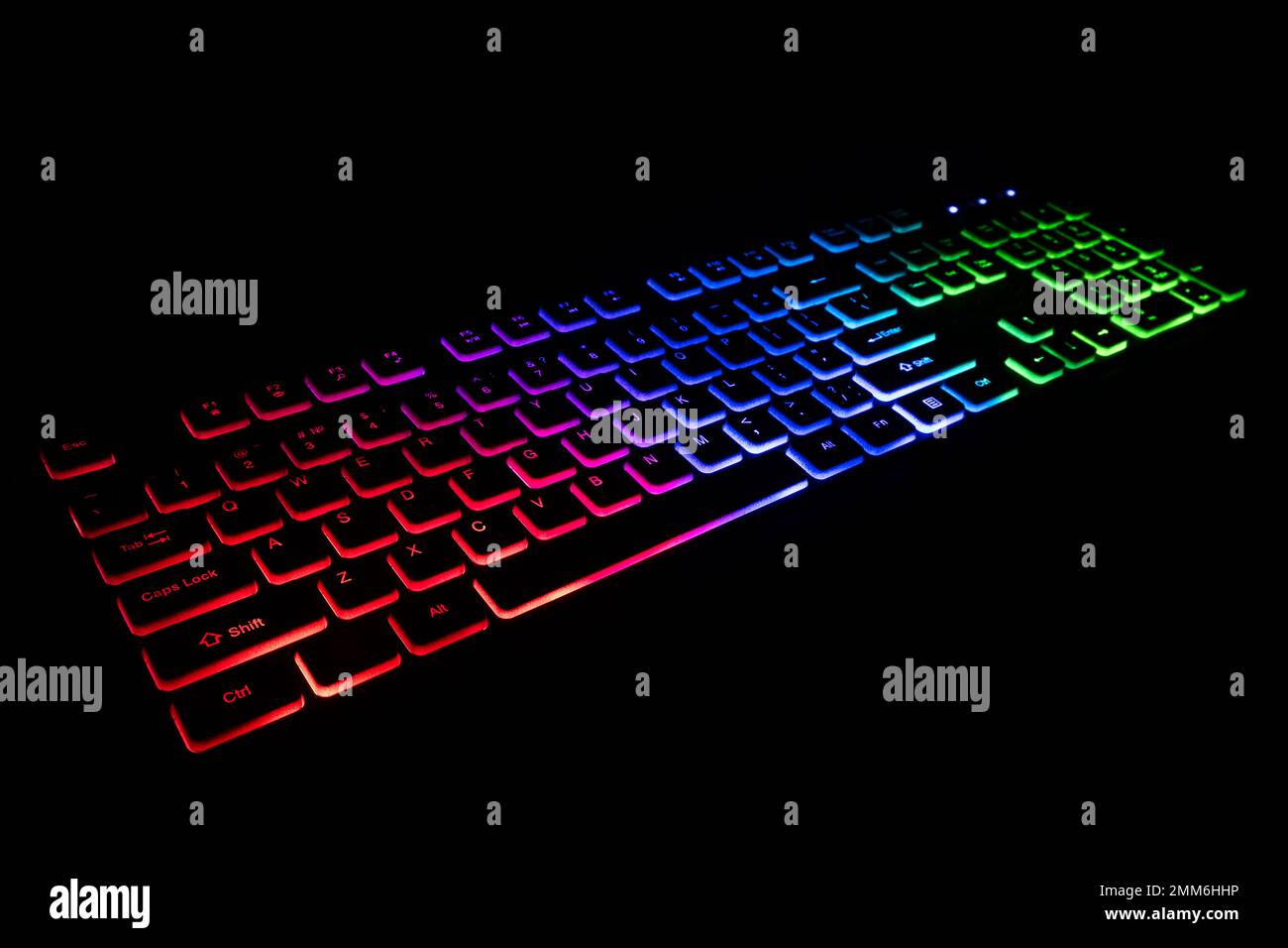 Game keyboard with color RGB backlight on black background. Selective ...