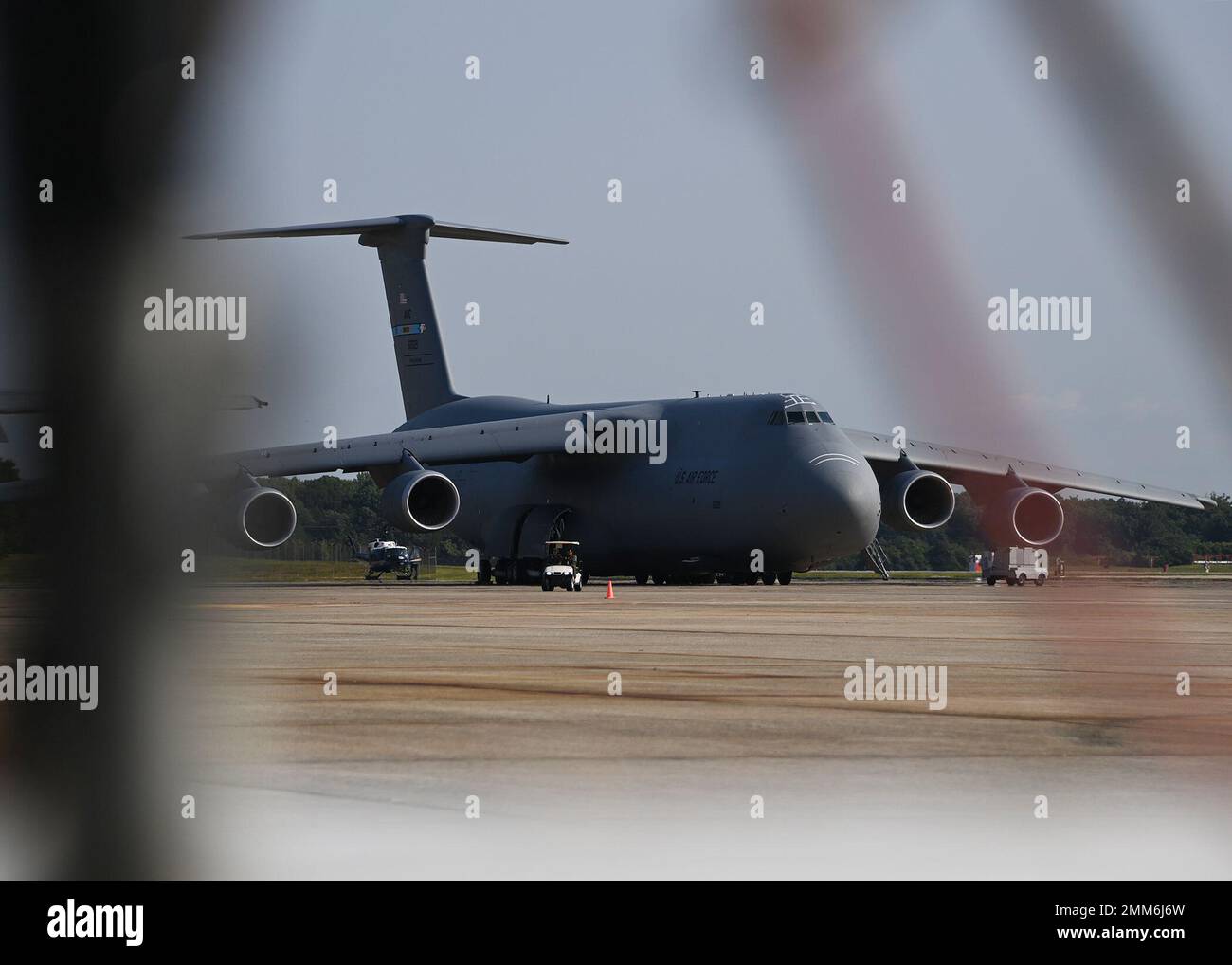 A C-5M Super Galaxy comes to a halt on the flight line at Joint Base ...