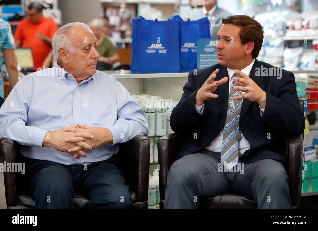 Presumed Governor-elect Ron DeSantis, right, chats with Jose Amat, one ...