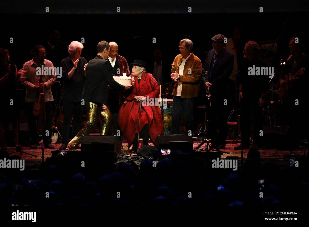 Joni Mitchell presented with a birthday cake on stage at JONI 75: A ...