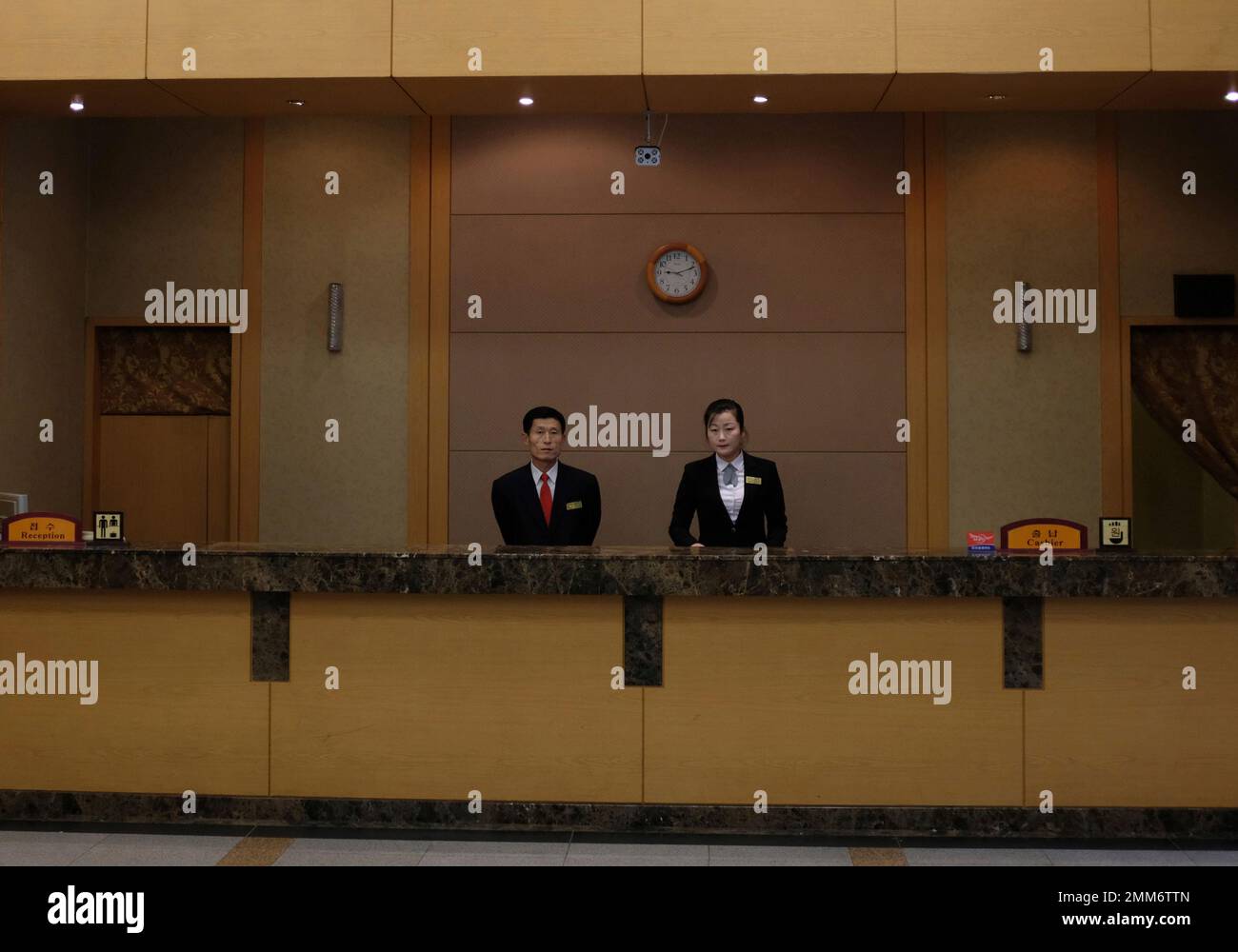 In this Oct. 23, 2018, photo, members of the staff stand behind the ...