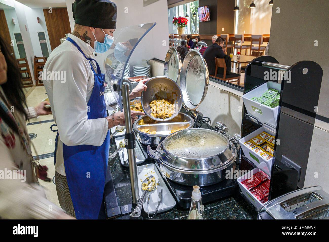 Free included breakfast self serve service buffet line hi-res stock ...