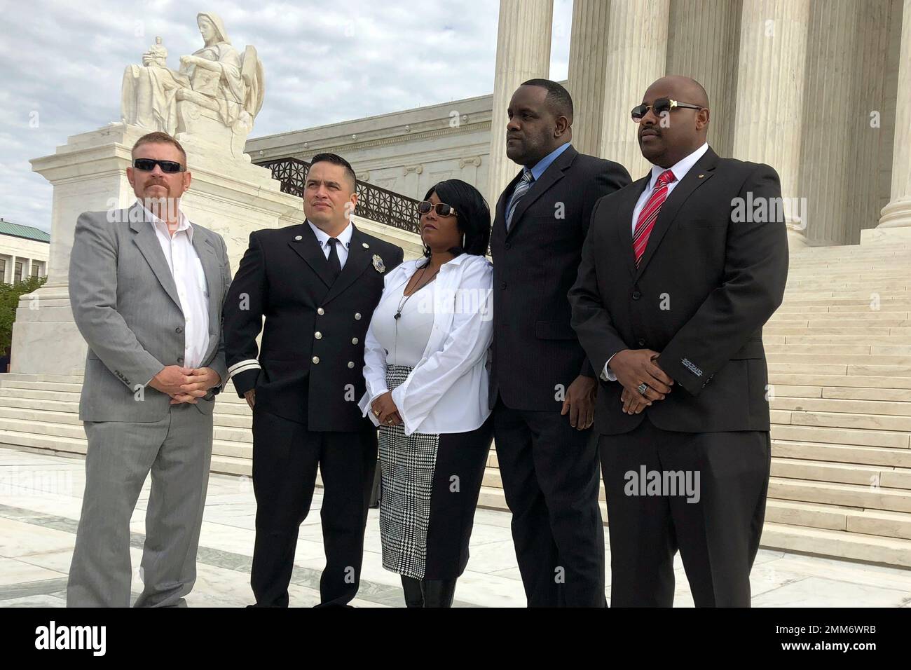 A group of victims of the USS Cole bombing, from left Rick Harrison and ...