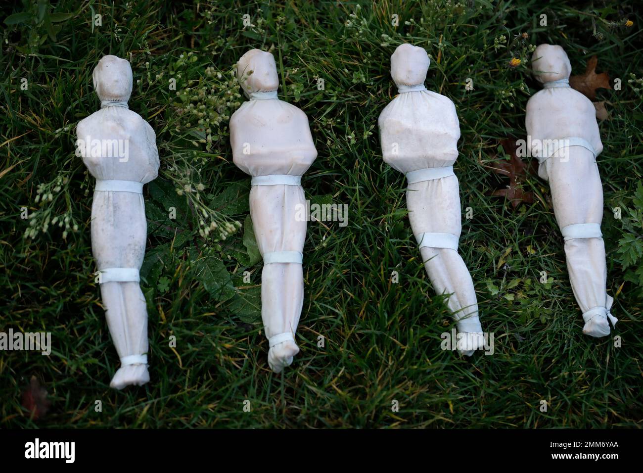 Shrouded figures forming part of British artist Rob Heard's piece of ...