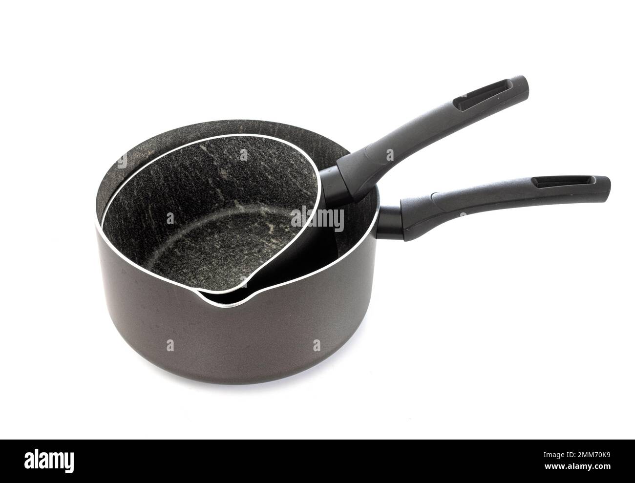 black saucepans in front of white background Stock Photo - Alamy