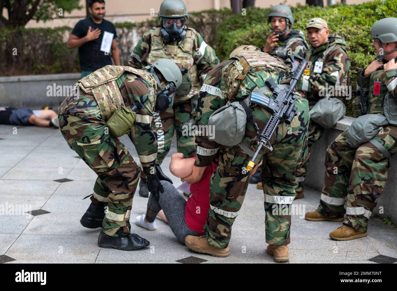 First responders assigned to the 51st Security Forces Squadron, move a ...