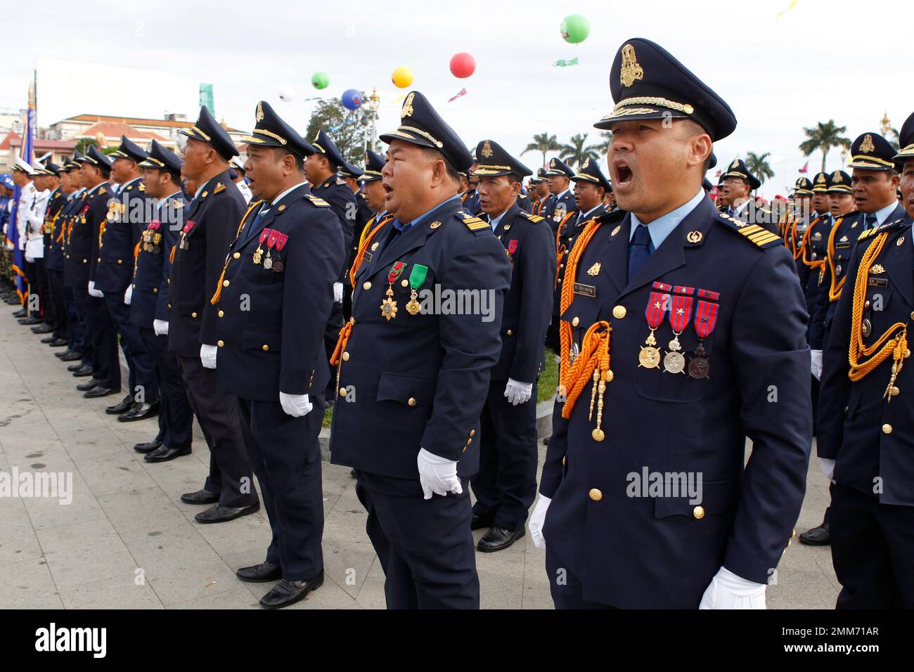 Cambodian police officers sing as they practice in front of Royal ...