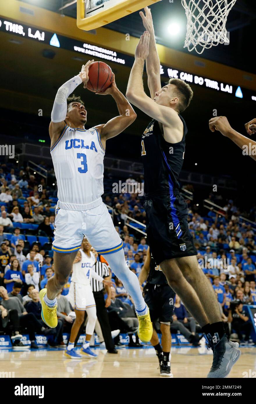 UCLA guard Jules Bernard shoots as Fort Wayne forward Dylan Carl ...