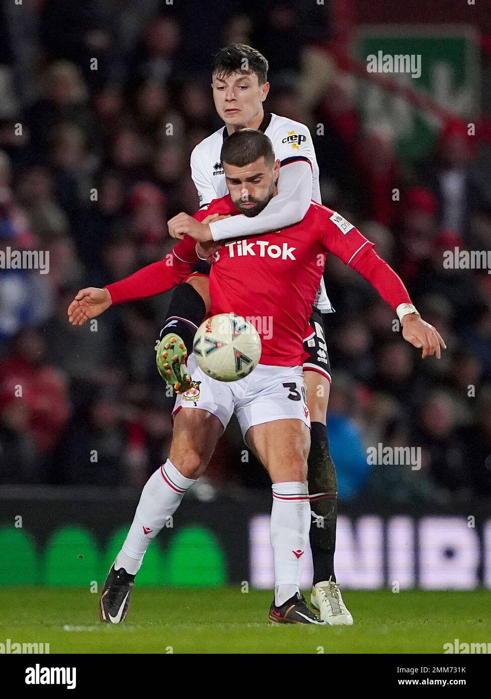 Wrexham's Elliot Lee (left) and Sheffield United's Anel Ahmedhodzic ...