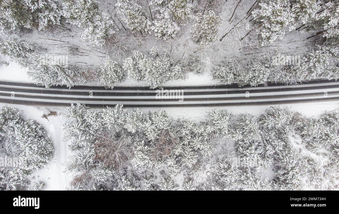 Aerial view of winter forest and the road. Bird's eye Stock Photo - Alamy