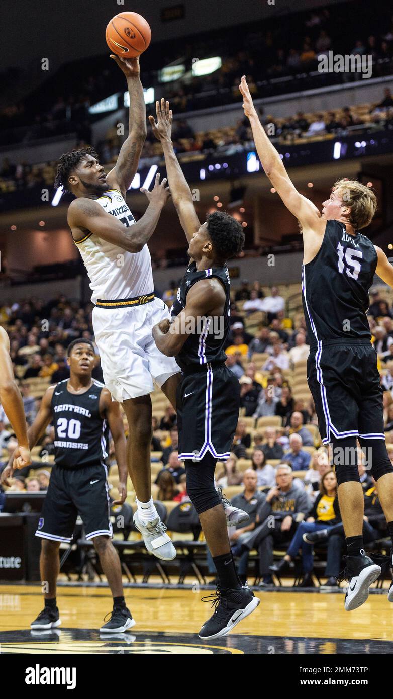 Missouri's Jeremiah Tilmon, left, shoots over Central Arkansas' SK ...