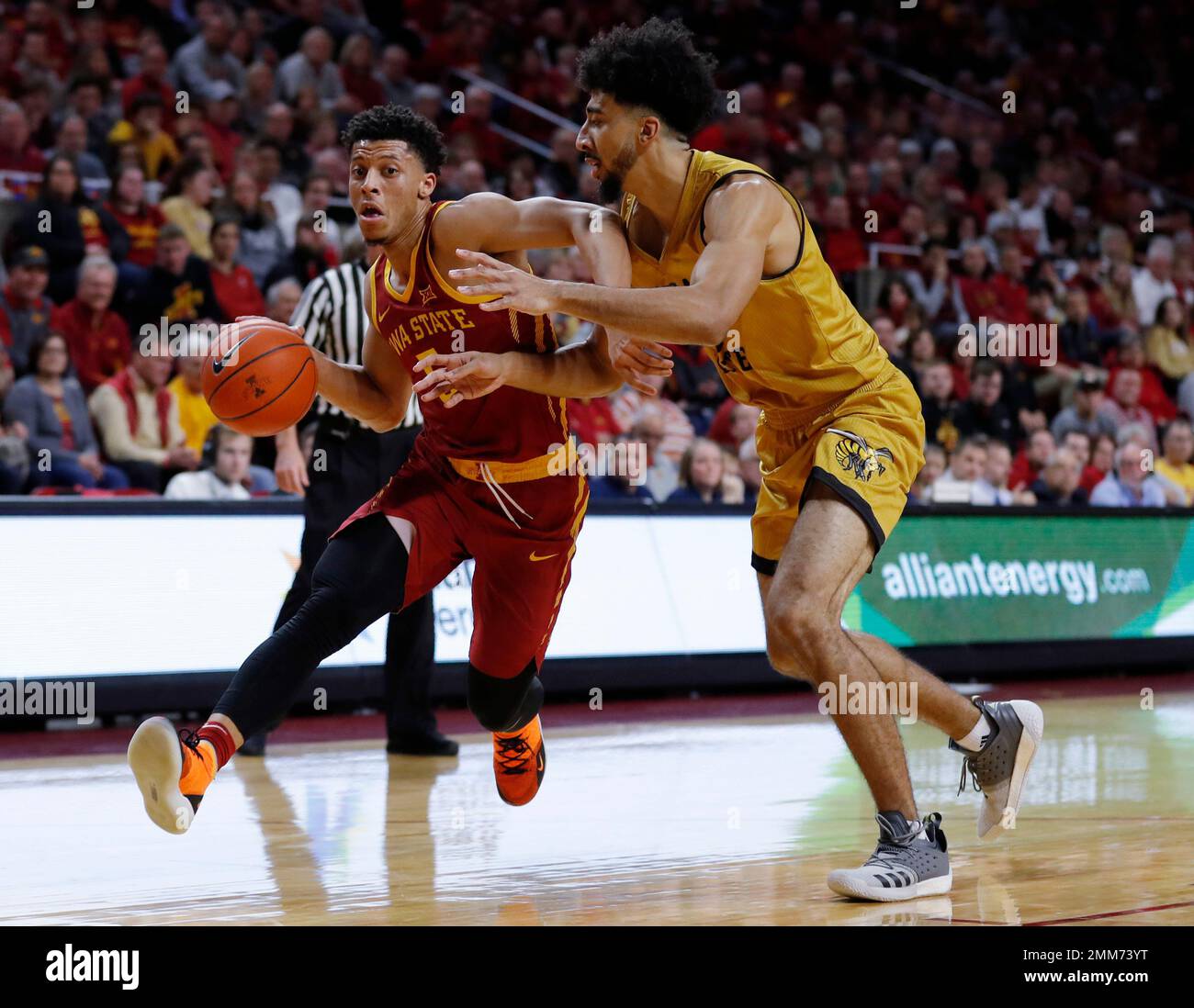 Iowa State guard Lindell Wigginton, left, drives past Alabama State ...