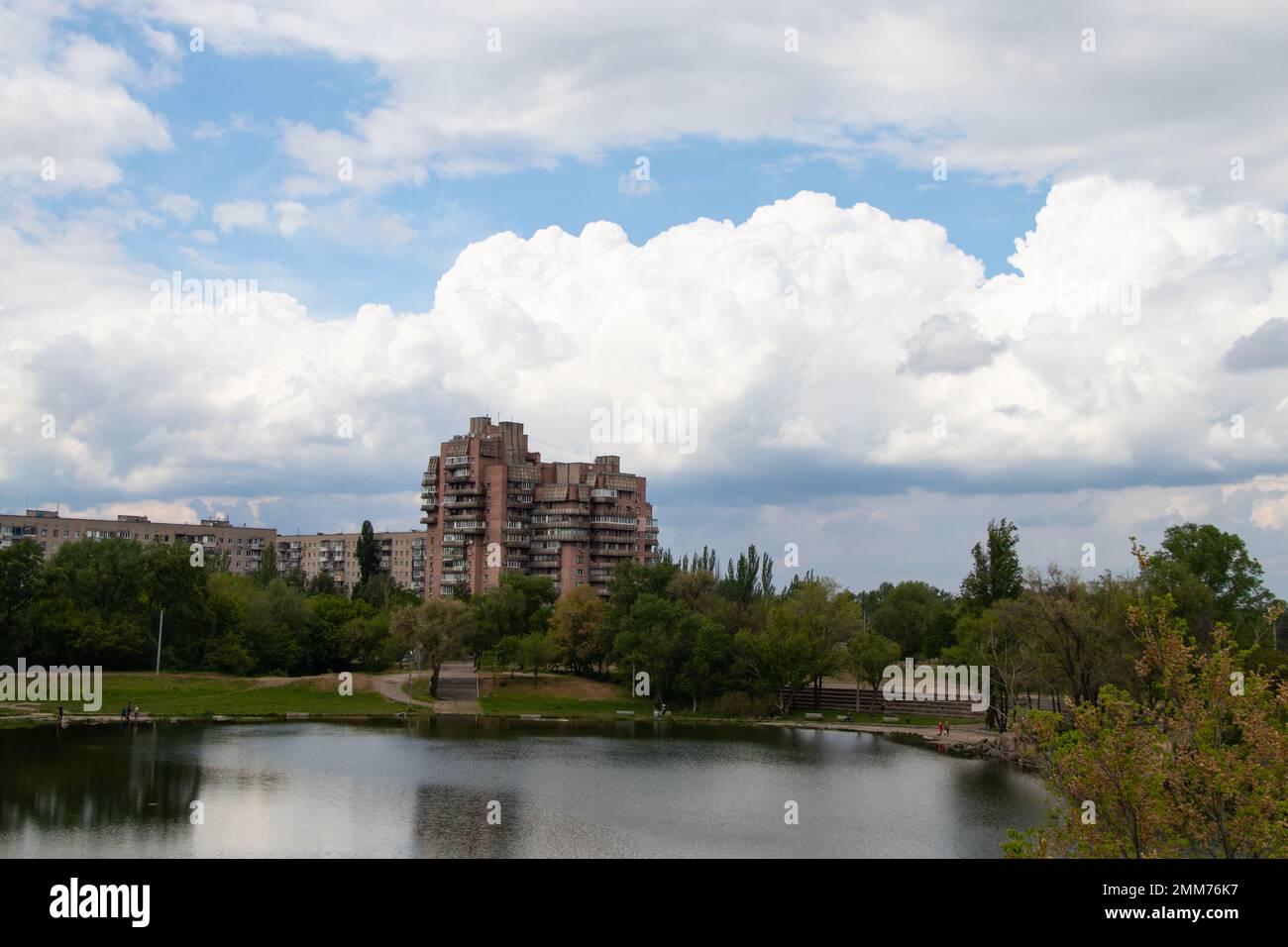multi-storey building on the background of a quarry in the red stone ...