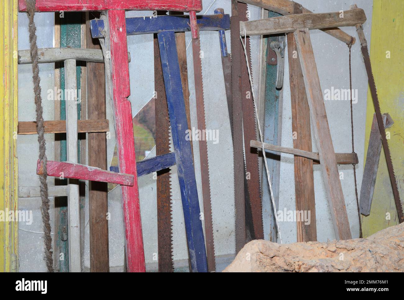 group of old wooden saws with serrated blade in carpenter's joinery ...