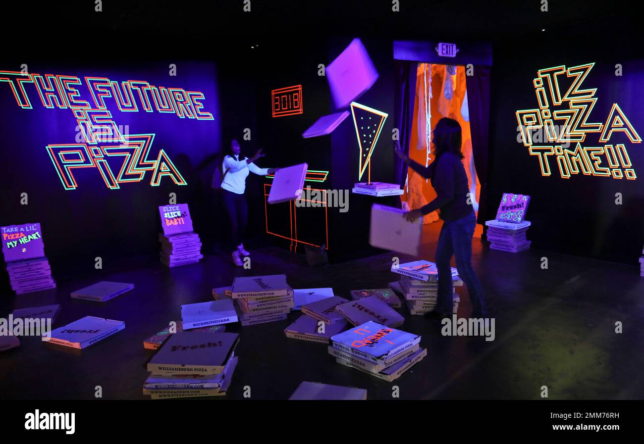 This Nov. 2, 2018 photo shows a pizza box playroom created with neon ...