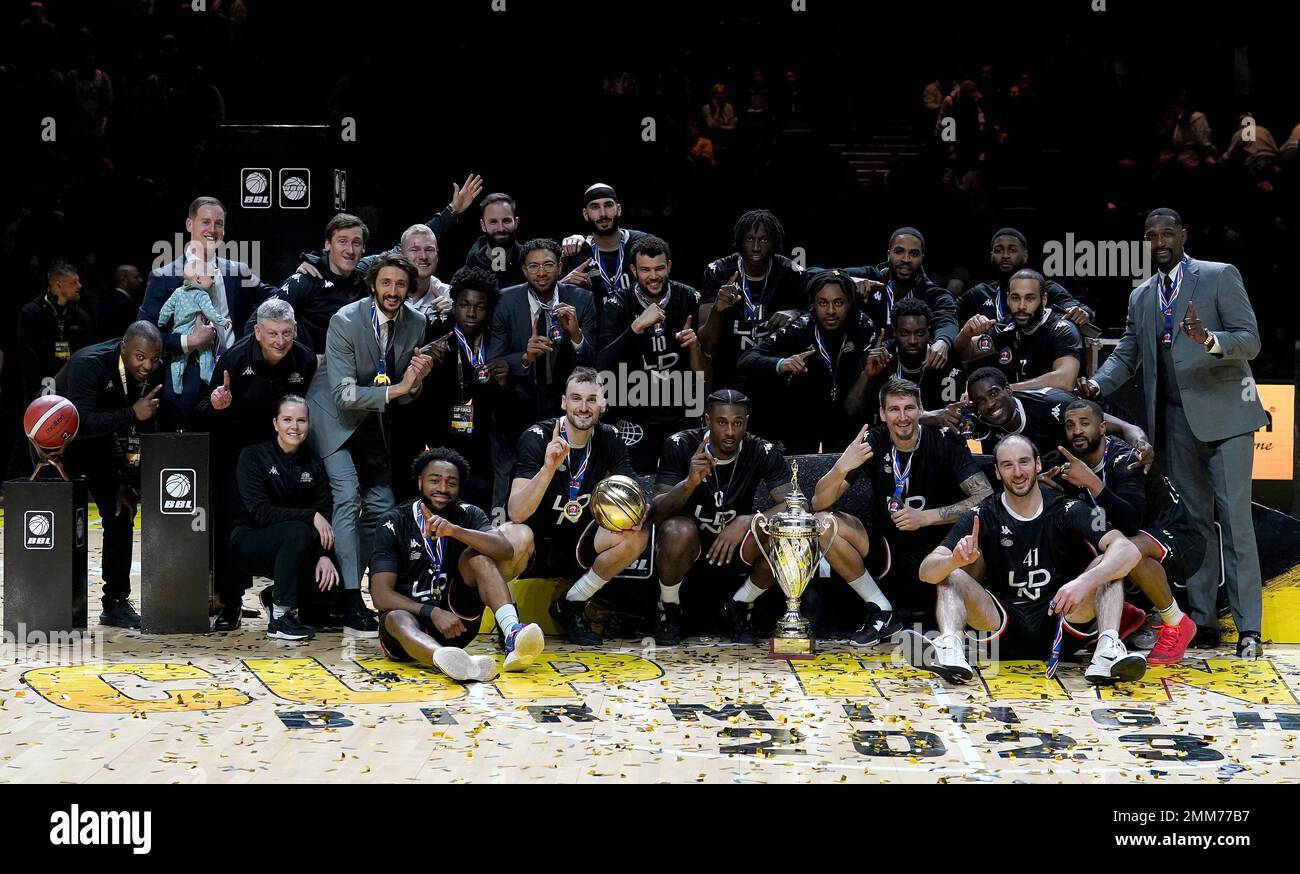 London Lions players celebrate with the trophy after beating Leicester ...