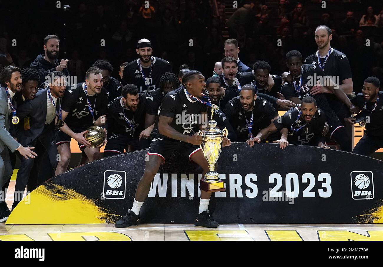 London Lions' Ovie Soko lifts the trophy after beating the Leicester ...