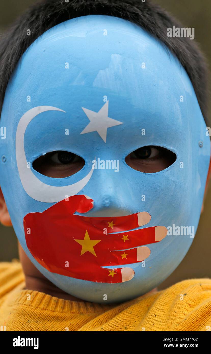 A child from the Uighur community living in Turkey wears a mask in the ...