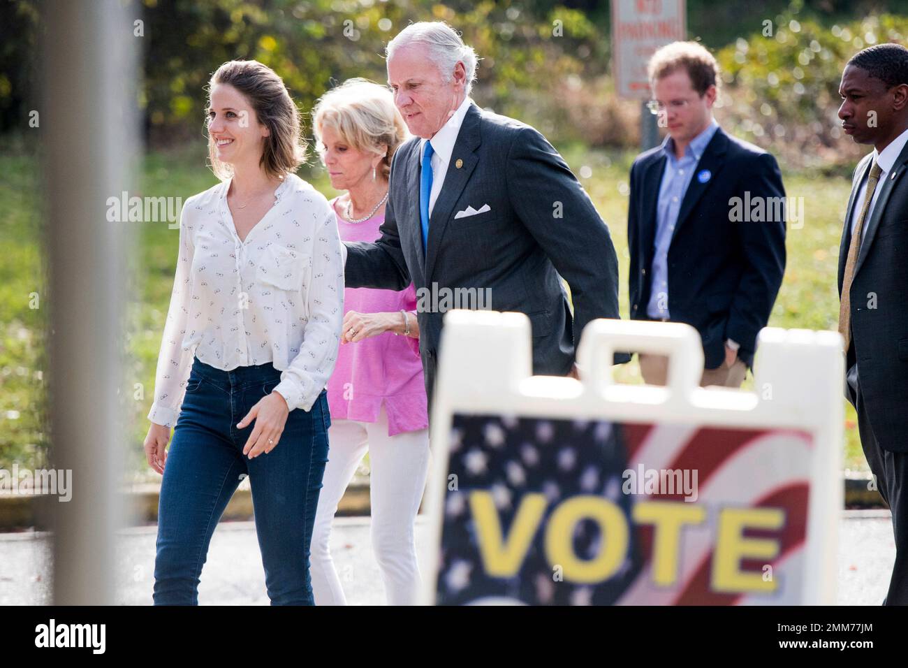 South Carolina Gov. Henry McMaster, right, arrives at a polling station ...