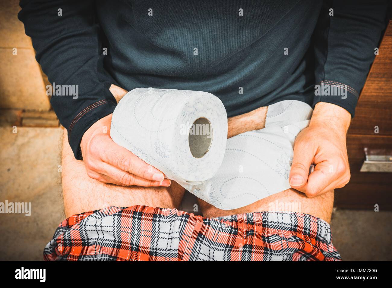 Women sitting on the toilet hi-res stock photography and images - Alamy
