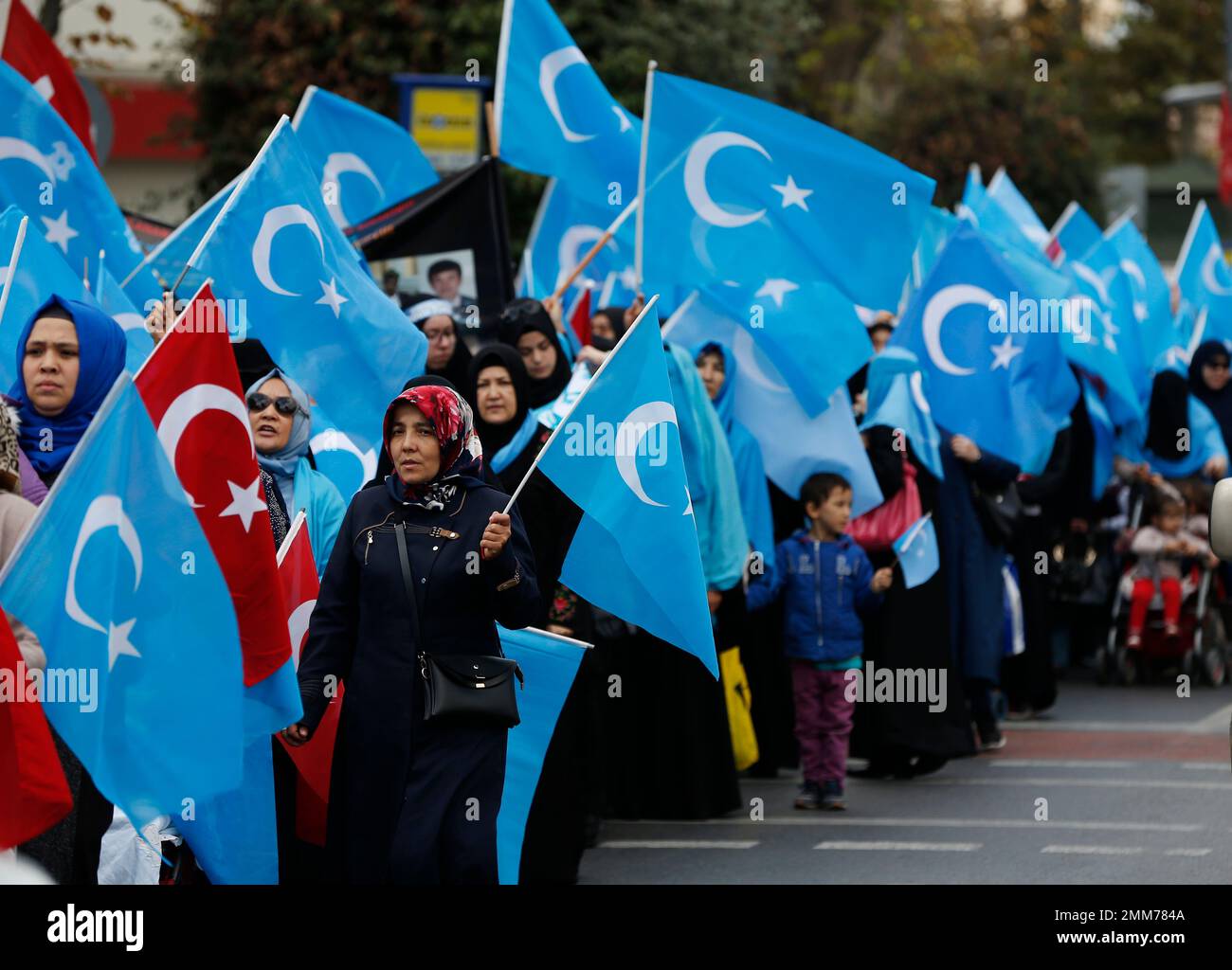 People from the Uighur community living in Turkey carry flags of what ...