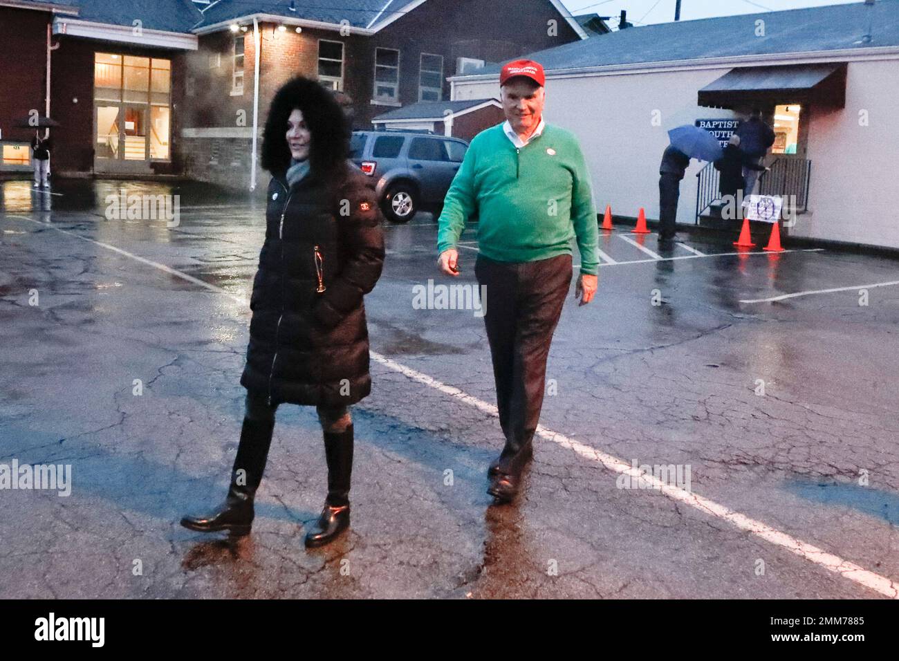 U.S. Rep. Mike Kelly, right, and his wife Victoria leave after voting ...