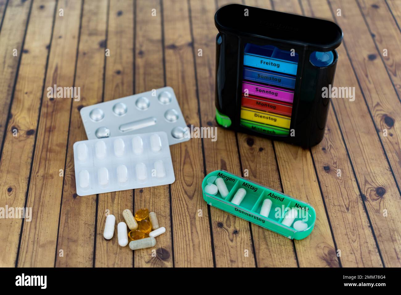 Weekly pills box for daily medication. Health care and pharmacy concept ...