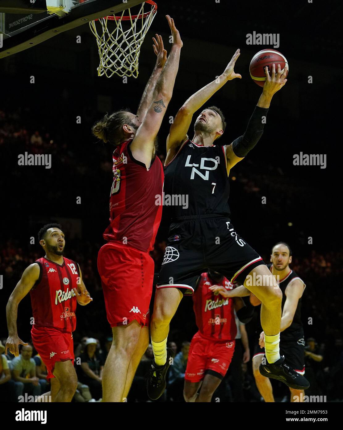 London Lions' Sam Dekker scores past Leicester Riders' Darien Nelson ...