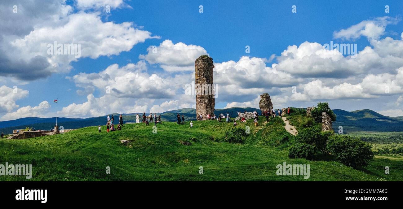 The ruins of Nógrád Castle, visitors taking part in castle games, a ...