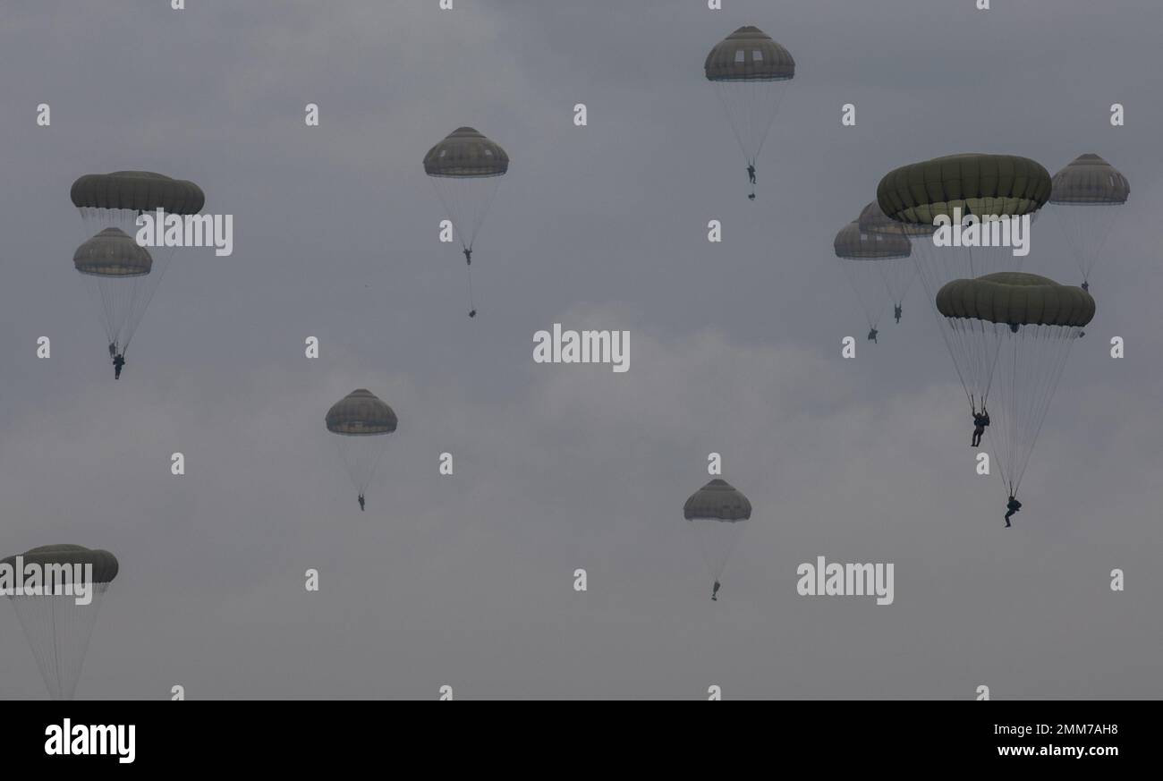 A group of U.S. Army and European Paratroopers conduct an Airborne jump ...