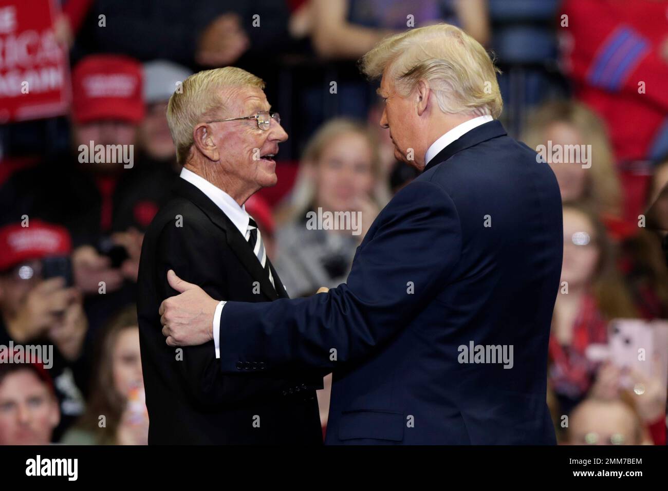 President Donald Trump greets former Notre Dame football coach Lou ...