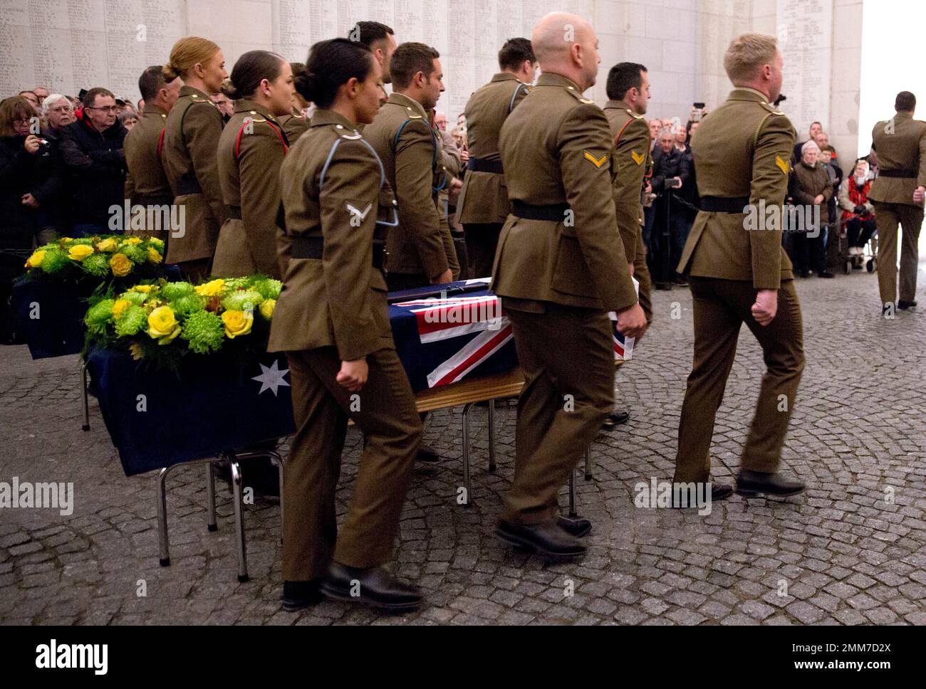 An Australian honor guard marches past the caskets of two unidentified ...