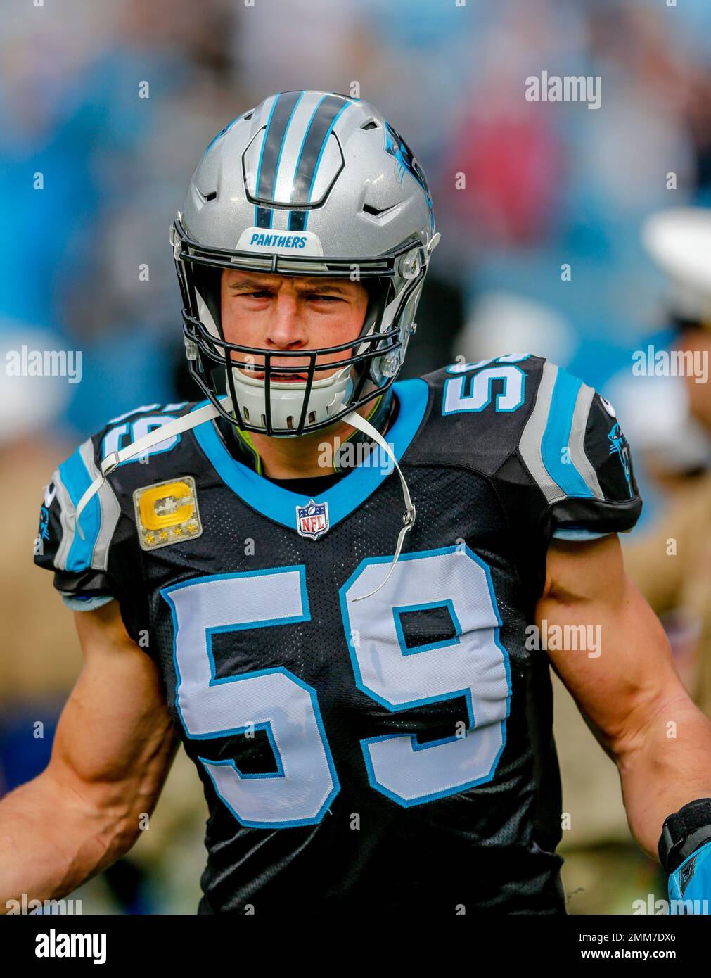 Carolina Panthers linebacker Luke Kuechly runs onto the football field ...