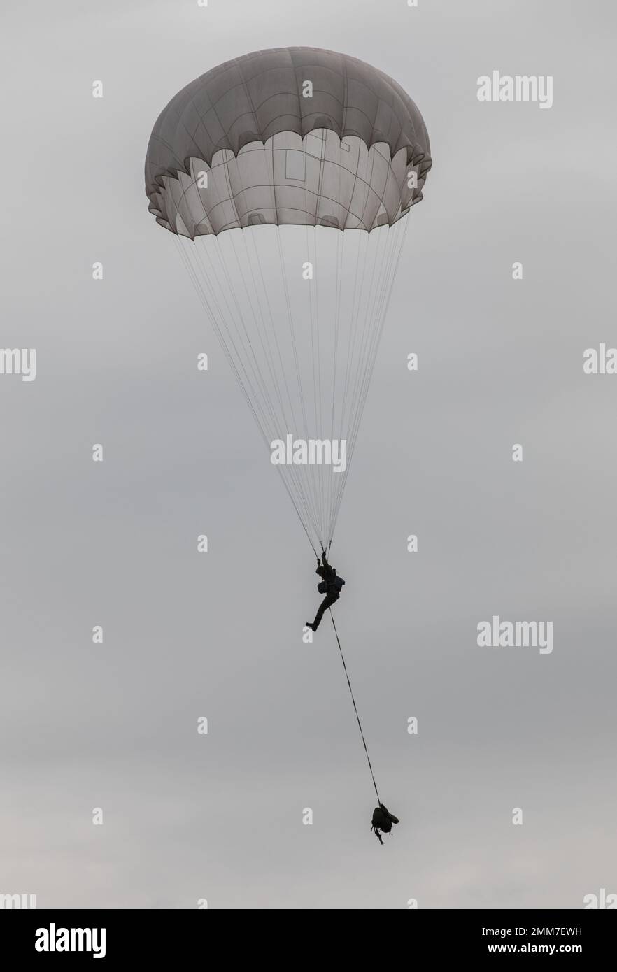 A German Paratrooper conducts an Airborne jump out of a C-130 aircraft ...