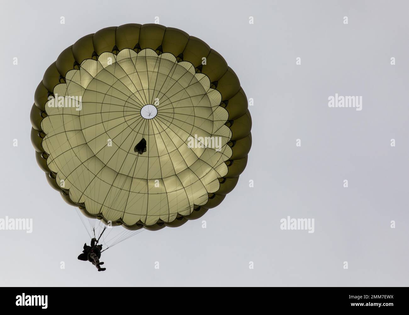 A Romanian Paratrooper conducts an Airborne jump out of a C-130 ...